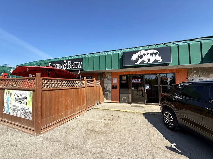 Red umbrellas and wooden fencing create the perfect summer hideaway for enjoying Alaska's finest burger creations.
