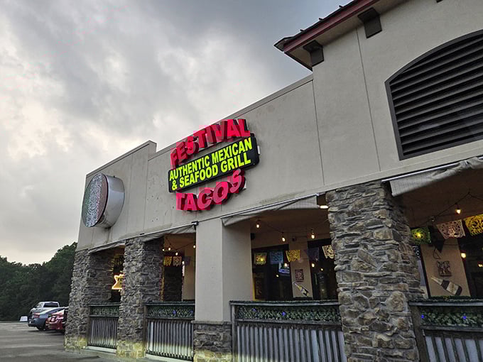 The neon "TACOS" sign glows like a beacon of hope for hungry travelers. This is where flavor festivals begin.