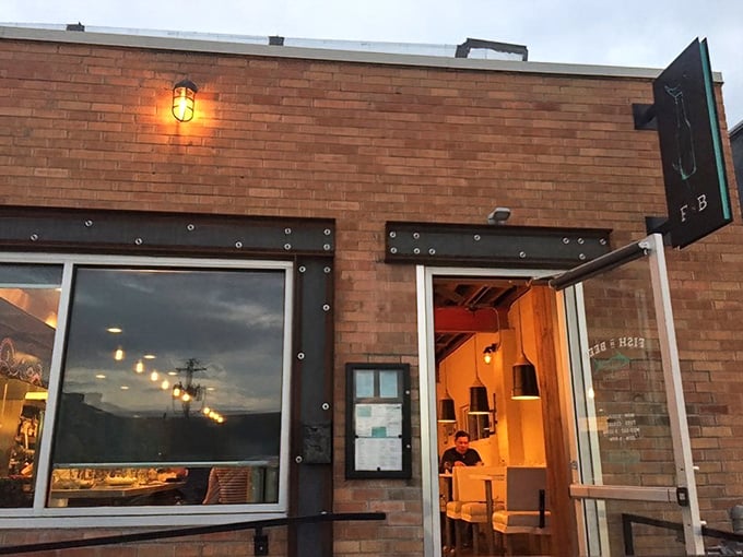 As evening falls, Fish N Beer's warm glow beckons seafood lovers like a lighthouse for the landlocked.