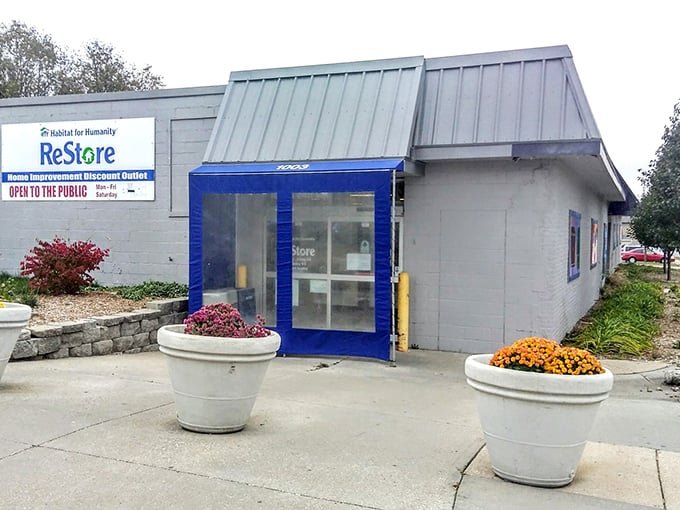 Flanked by cheerful flower pots, this ReStore entrance is like the wardrobe to Narnia &ndash; ordinary outside, magical bargains inside.