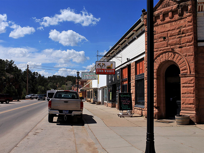 The charming storefronts of Hot Springs invite you to park your car and your worries. That Vault signage practically whispers "come sit a spell."