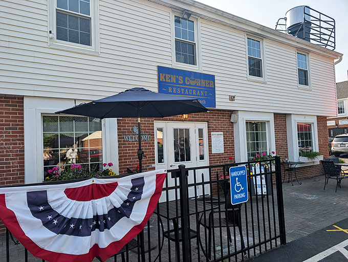 American flag and outdoor seating at Ken's Corner &ndash; because pancakes taste better with a side of fresh air and patriotism.