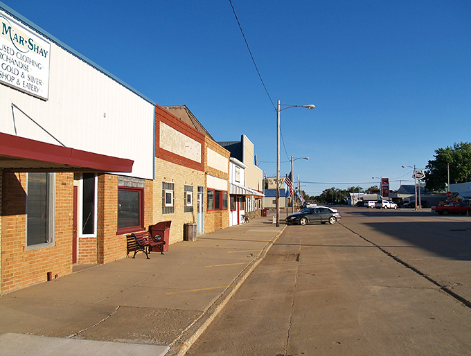 Classic brick storefronts line peaceful streets where parking is plentiful and neighbors still wave from their pickup trucks.