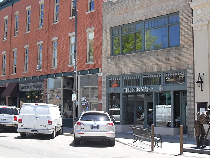 Historic brick buildings line Loveland's charming downtown, where places like Henry's offer a taste of local flavor and community spirit.