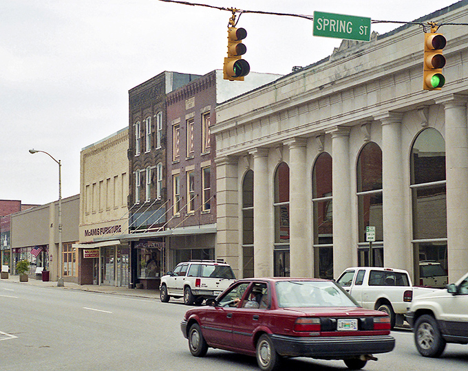 Historic Spring Street in McMinnville, where brick buildings tell stories and affordable apartments hide above quaint storefronts.