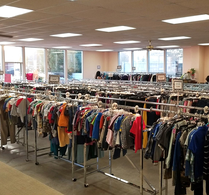 A thrifter's paradise of neatly organized clothing racks – like a department store without the sticker shock!