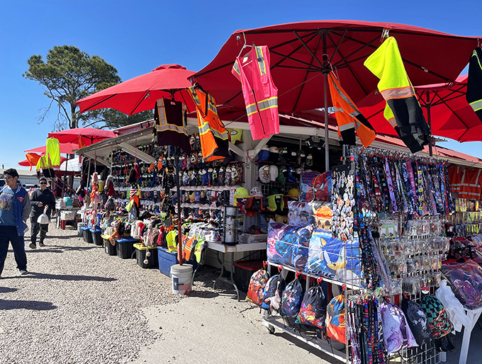 Bargain bonanza under red umbrellas! This vibrant vendor stall at Pearland offers everything from toys to safety vests at prices that'll make you smile.