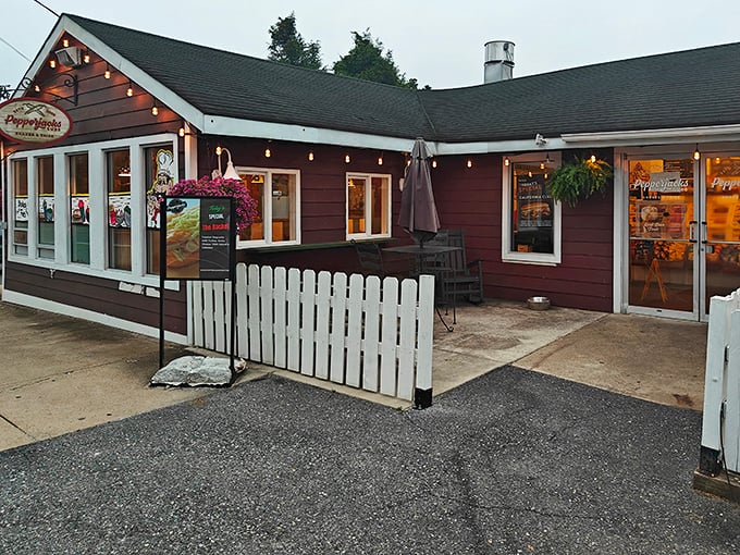 Evening lights transform Pepperjacks into a warm beacon for sandwich lovers. That white picket fence isn't keeping anyone away from these subs!