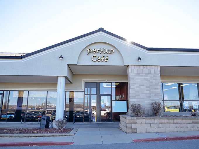 Morning sunshine bathes PerKup Cafe's entrance &ndash; a beacon of breakfast hope for the caffeine-deprived masses of West Des Moines.