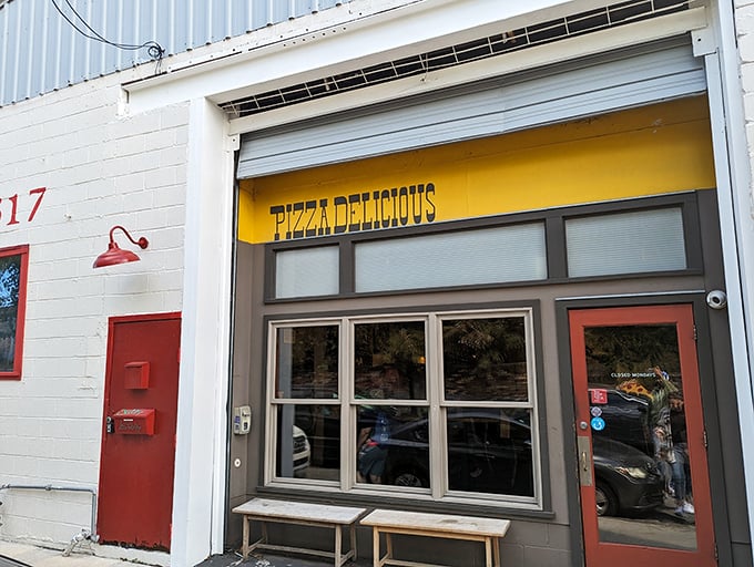 The bright red door at Pizza Delicious beckons like a portal to New York-style heaven in the heart of New Orleans.