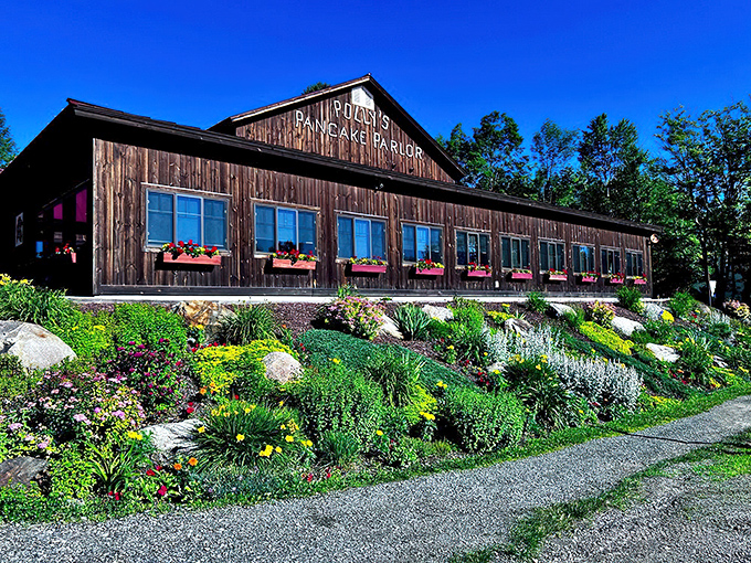 Garden paradise meets pancake heaven! Polly's charming barn exterior is framed by flowers that somehow make waiting for breakfast even sweeter.