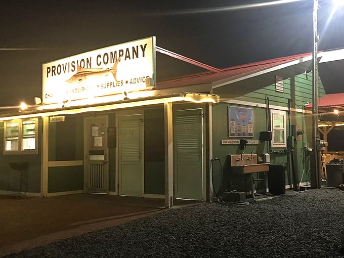 By night, this humble seafood shack transforms into a beacon for hungry souls seeking the authentic taste of coastal Carolina.