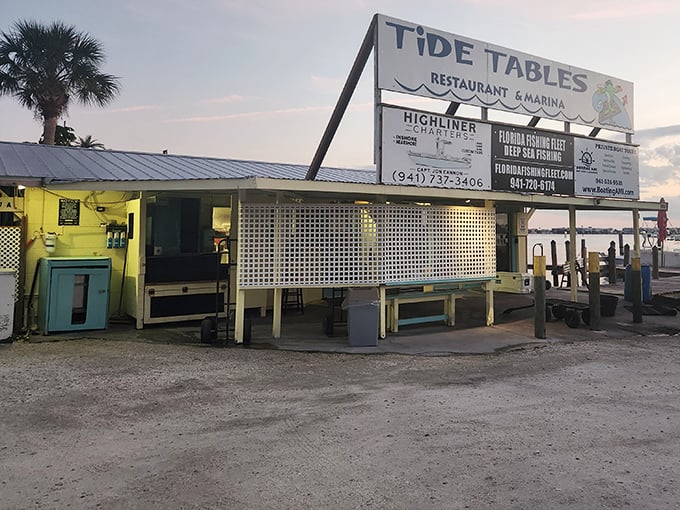 Sunset at Tide Tables - where the day's catch meets its delicious destiny while boats gently rock nearby.