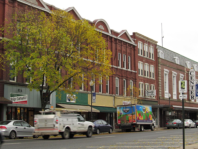Classic brick storefronts line Waterville's Main Street, where local businesses thrive in buildings that tell a century of stories.