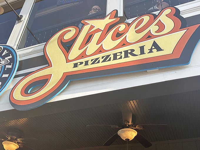Slices' bold signage promises what every pizza lover seeks: that perfect New York-style fold that keeps the toppings where they belong &ndash; in your mouth, not your lap!
