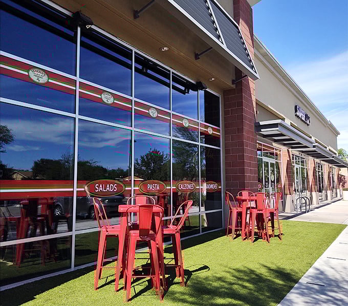 Those cheerful red chairs outside Venezia's aren't just for show&mdash;they're front-row seats to some serious pizza magic.