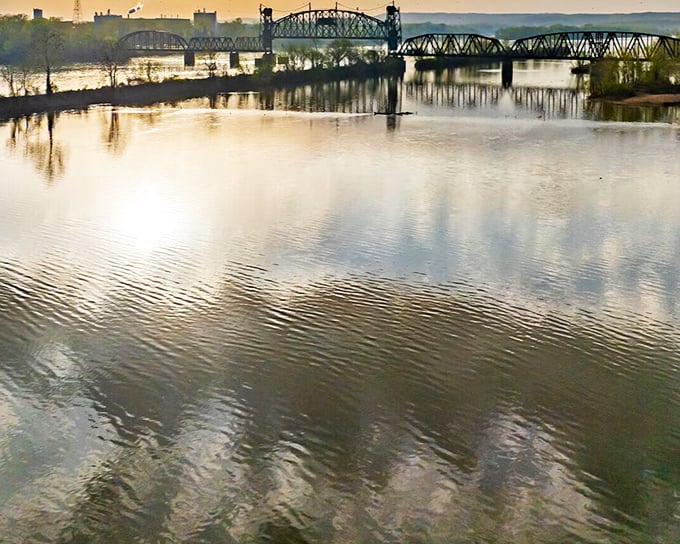 The Arkansas River reflects golden light like nature's own free therapy session for weary souls.