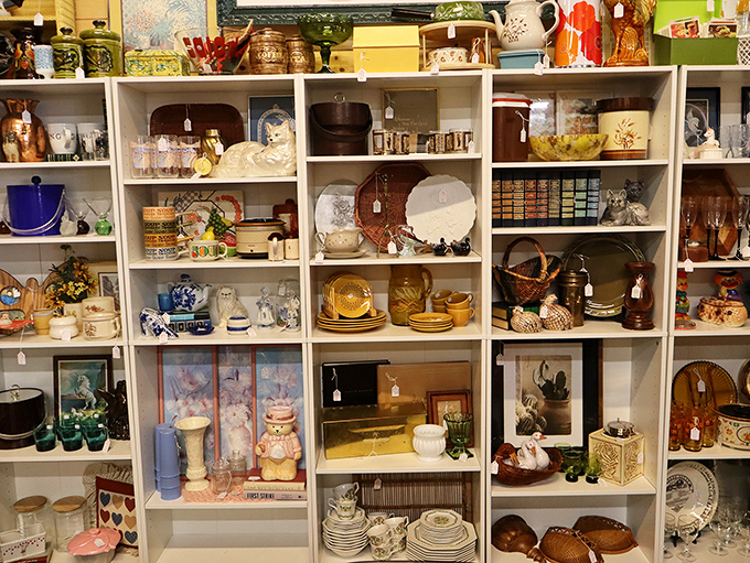 Shelves bursting with vintage treasures tell stories of decades past. That yellow Pyrex bowl? It probably served Jell-O salad at Kennedy-era dinner parties.