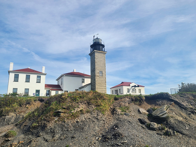 Beavertail Lighthouse stands sentinel on rocky shores, its sturdy tower a reassuring presence that's guided mariners safely home since the 1850s.
