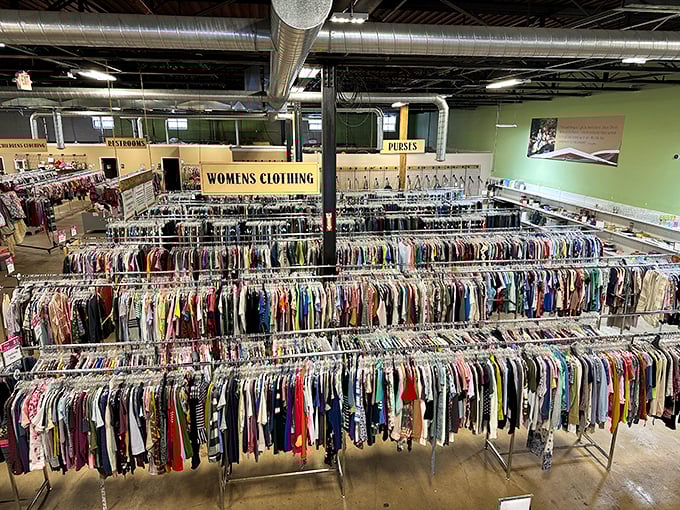 A sea of hangers creates a colorful textile ocean &ndash; the women's clothing section stretches toward the horizon.