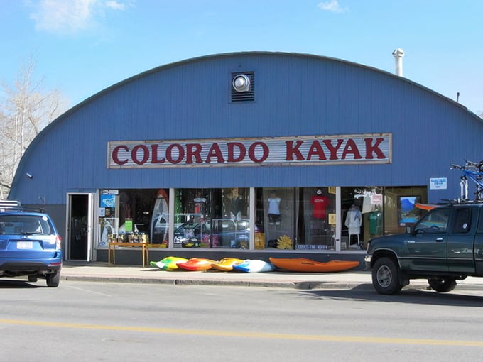 Colorado Kayak's distinctive blue quonset hut stands as a beacon for river enthusiasts, like a waterproof candy store for adults with adventure on their minds.