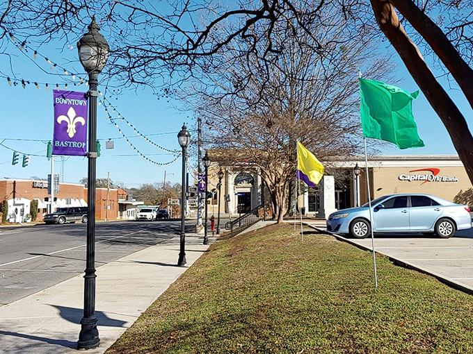 Purple and gold banners line Bastrop's downtown streets, where modern amenities blend seamlessly with the town's historic character and unhurried pace.