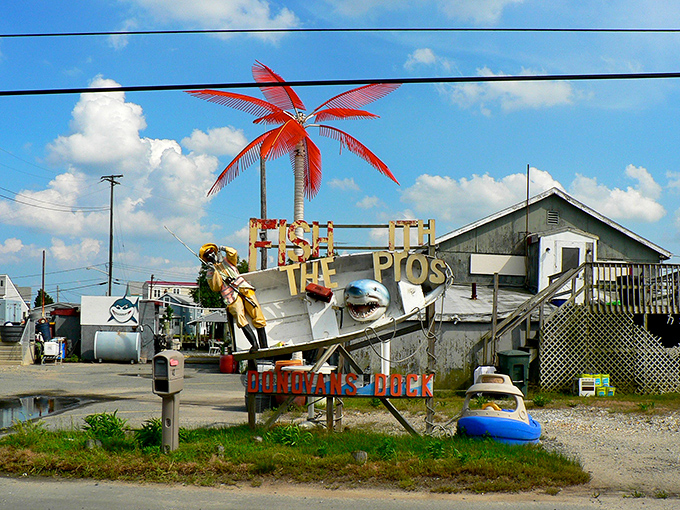 JP's Wharf's whimsical entrance featuring a red palm tree and shark &ndash; coastal kitsch at its most charming. Florida called and said, "Well played, Delaware."