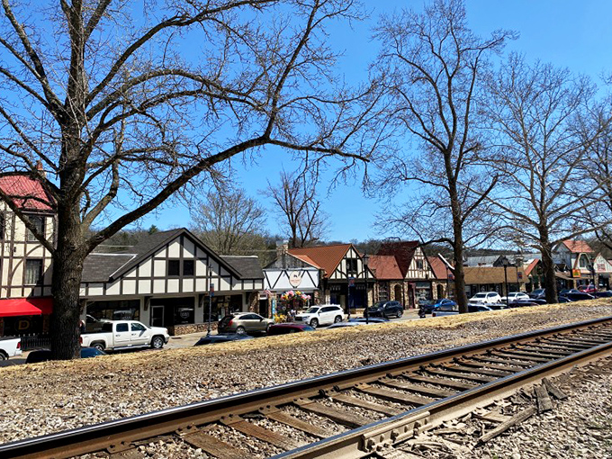 The railroad tracks that helped birth this unique town now provide a perfect vantage point for appreciating Hollister's architectural harmony against the Missouri landscape.