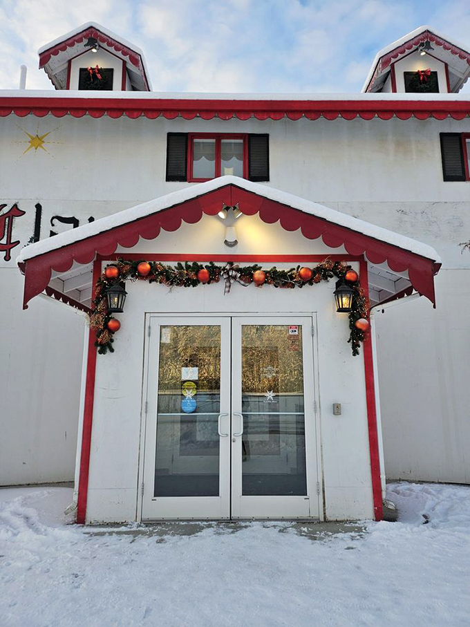Even in summer, this festive entrance welcomes visitors with holiday cheer. The snow just makes it feel more authentic!