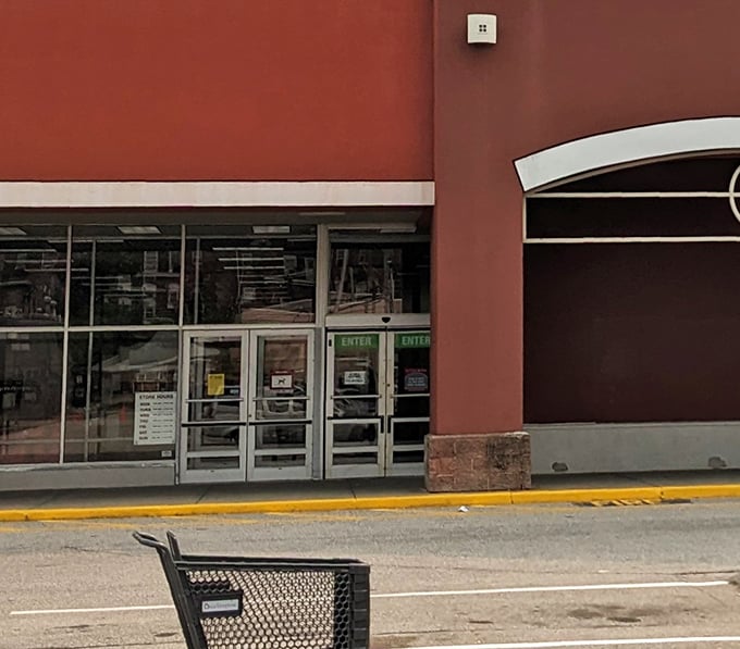 The entrance beckons with the promise of retail therapy that won't require a second mortgage. Those green "ENTER" signs might as well say "SAVE."