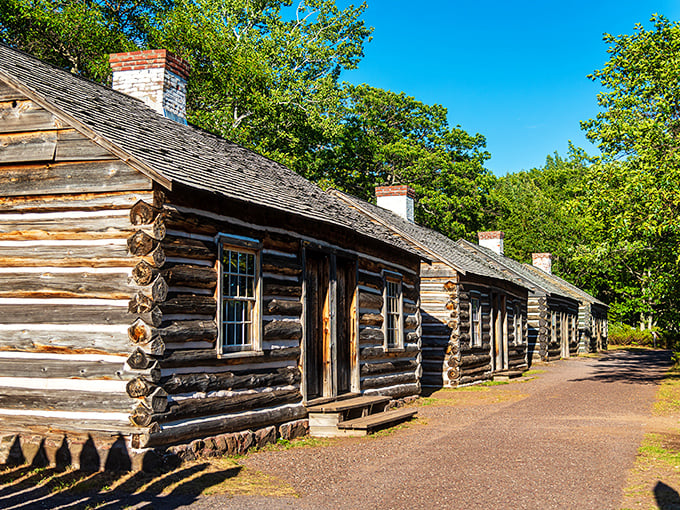 Fort Wilkins' preserved log cabins whisper stories of 1840s frontier life, when this outpost marked civilization's edge.
