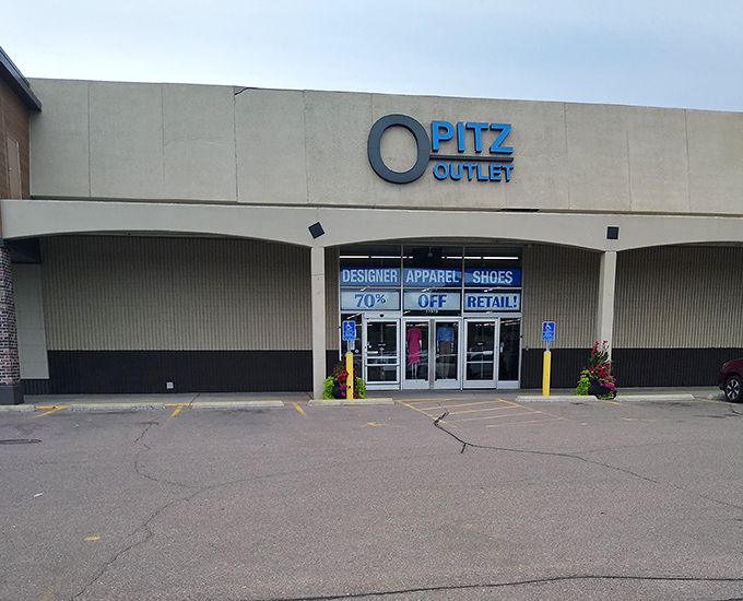 Bold blue signage announces the fashion paradise's promise: 70% off retail! In Minnesota, where practical value meets style, this storefront is the gateway to bargain heaven.