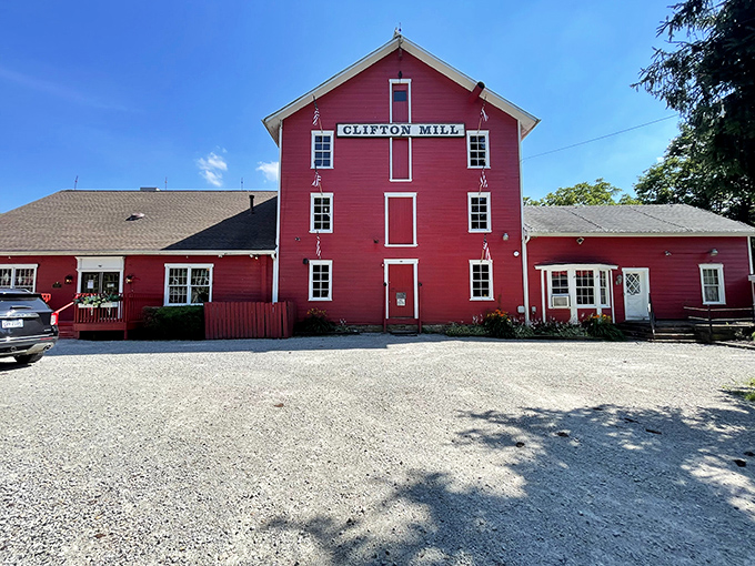 The iconic red Clifton Mill stands as a working testament to Ohio's industrial heritage, grinding stories as finely as its flour.