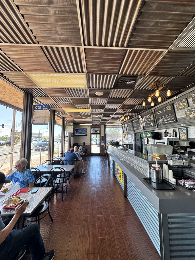 The corrugated metal ceiling and no-nonsense interior say everything you need to know: this place prioritizes sandwich perfection over Instagram aesthetics.