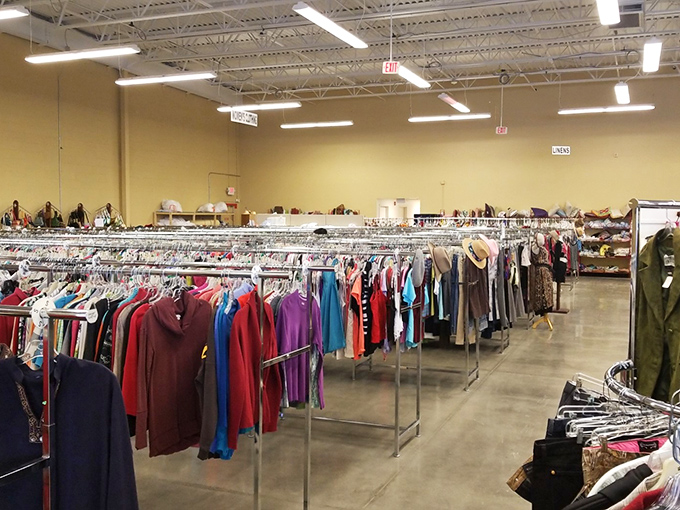 Rack after meticulously organized rack stretches toward the horizon like a textile rainbow, each item waiting for its second chance.