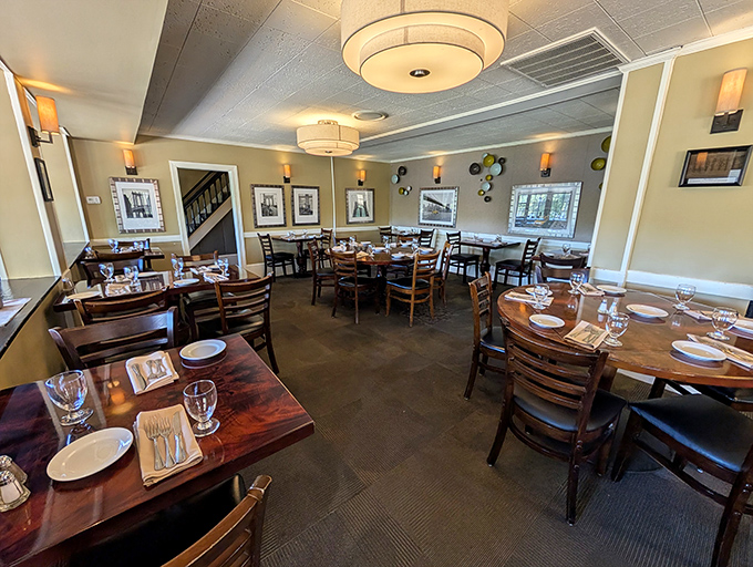 Sunlight streams through windows illuminating polished wood tables where countless memorable meals have unfolded in this inviting dining room.