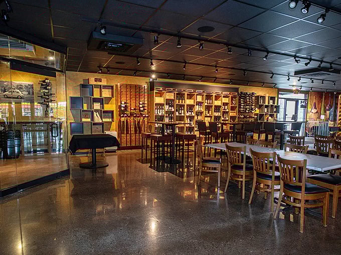 Wine bottles stand at attention like eager soldiers, ready to complement your meal in this warm, inviting dining space.