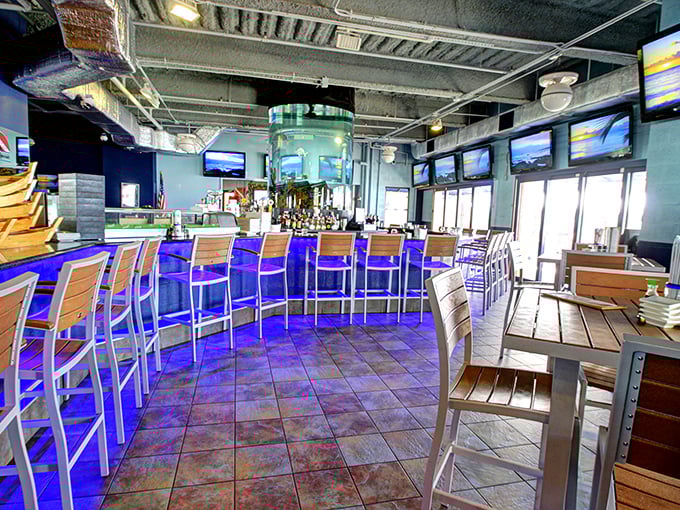 Cool blue lighting transforms this "dive bar" into an upscale oasis. The modern interior feels more South Beach chic than fishing shack.