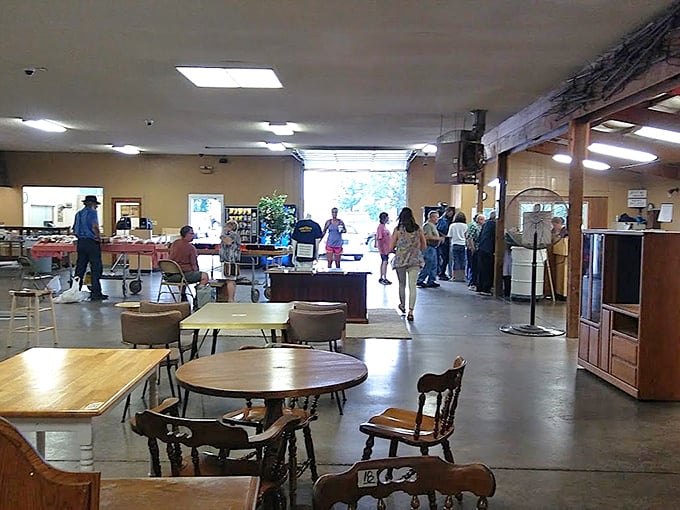 The auction floor buzzes with anticipation as treasures await new homes. Every table tells a story, every chair holds possibilities.