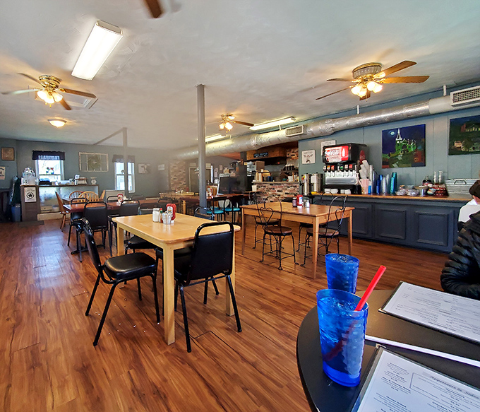 Simple wooden floors, ceiling fans spinning lazily overhead, and tables that have hosted more breakfast revelations than a Sunday morning talk show.