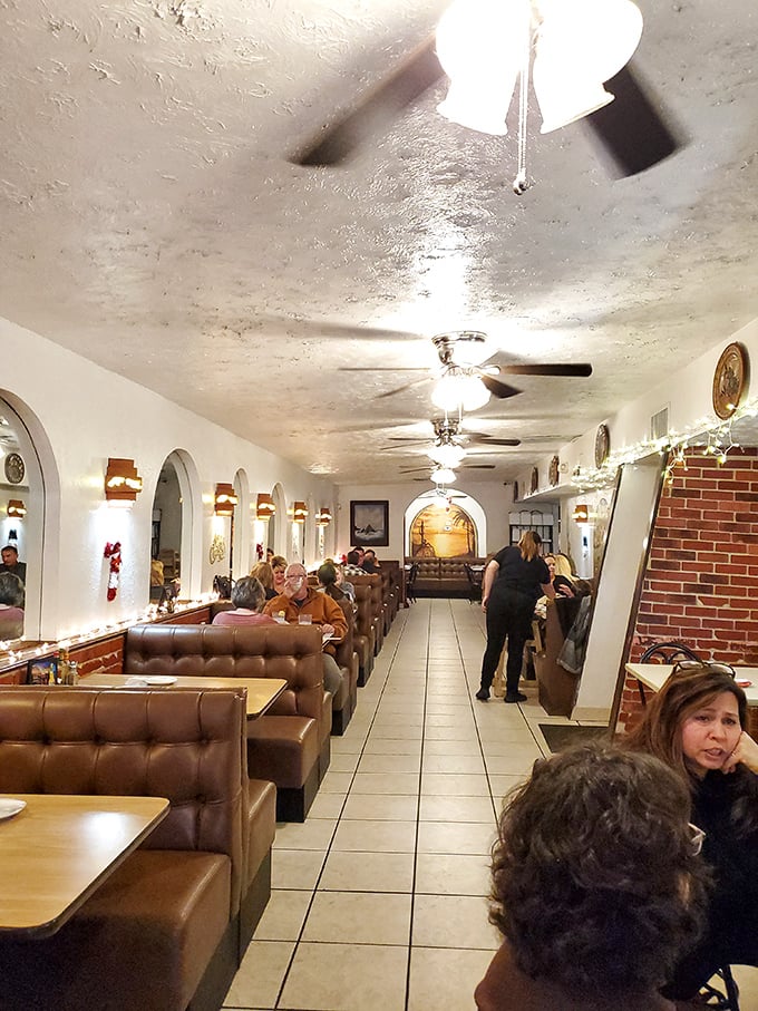 Step inside and the magic reveals itself&mdash;brown leather booths, arched alcoves, and a dining room that stretches back like a portal to Mexico City.