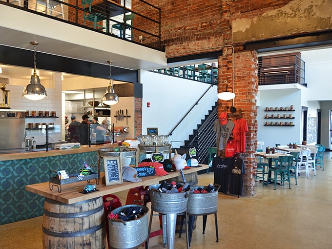 Industrial meets homey in this thoughtfully designed interior, where exposed brick walls and modern fixtures create the perfect backdrop for the serious business of barbecue appreciation.