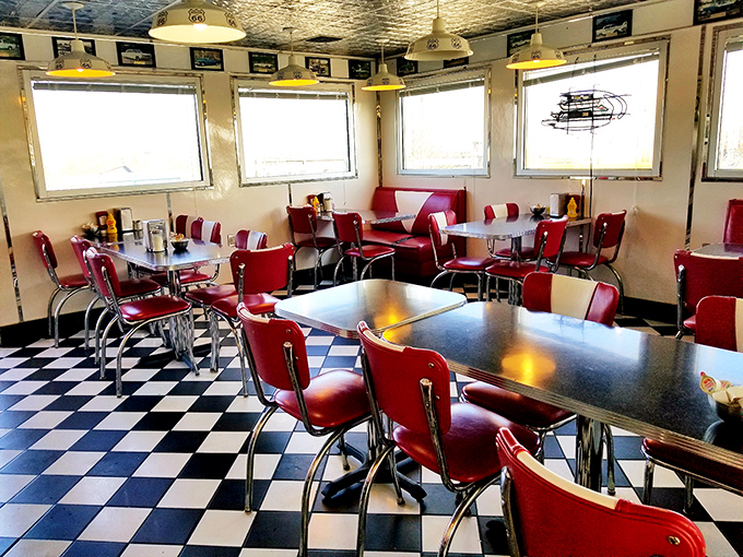 Classic red vinyl meets checkerboard floors in this time capsule where calories don't count and conversations flow as freely as the coffee.
