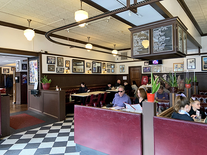 Classic checkered floors and vintage pendant lights transport diners to a simpler time when calories weren't counted, just savored.