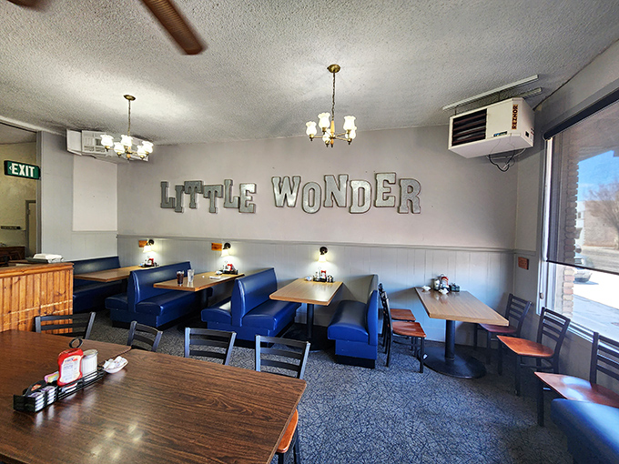 Blue booths and simple tables create the perfect backdrop for conversation, while metal lettering proudly announces this unpretentious eatery's identity.