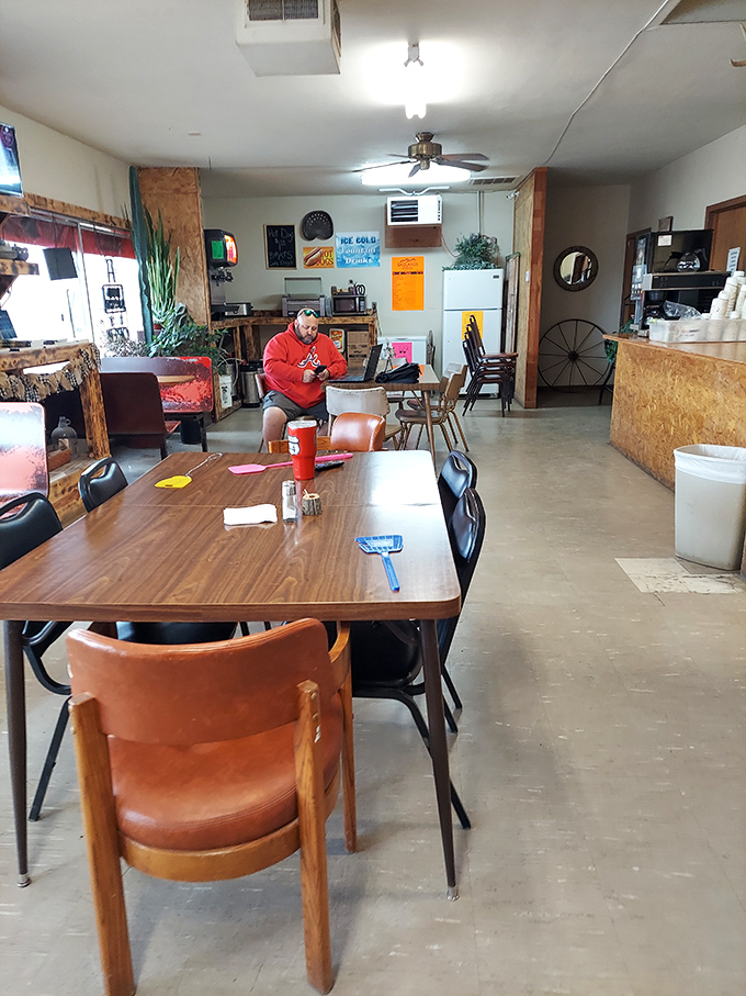 Simple wooden tables, no-frills chairs, and a ceiling fan spinning lazily overhead—this is South Dakota dining at its most authentic.