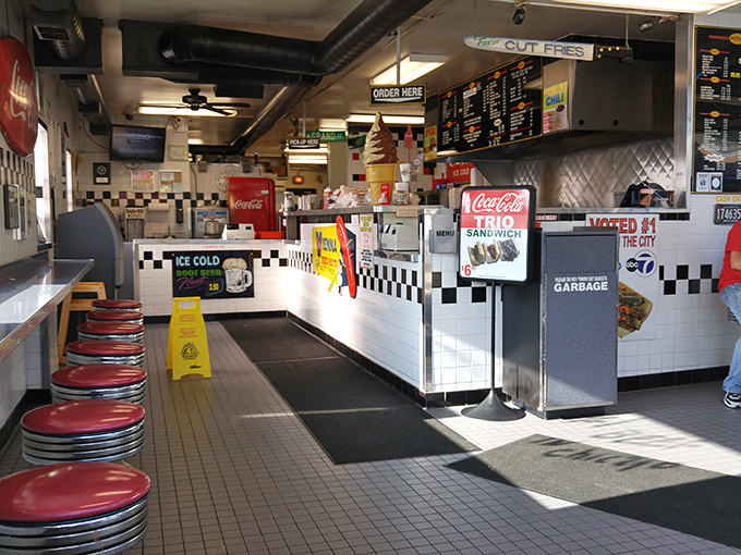 The interior is a time machine to when fast food meant character, not chains. Those red counter stools have supported generations of beef-loving Chicagoans.