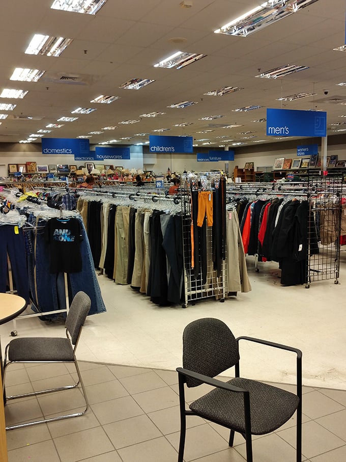 Department store organization meets thrift store prices. The blue signs hovering above like retail angels guide you through this bargain wonderland.