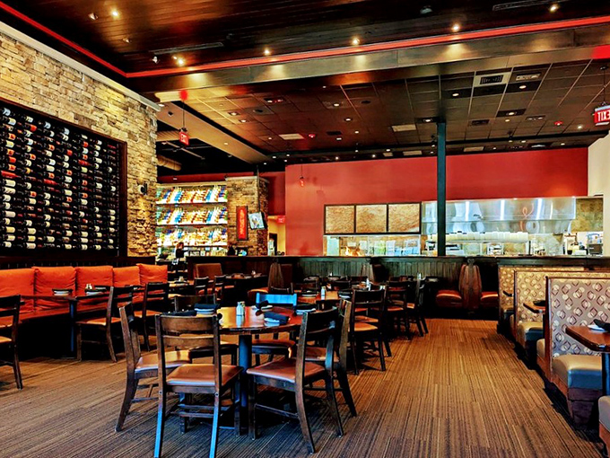 Warm wood tones, stone accents, and that signature wine wall create an atmosphere that's upscale without being uptight. Comfort meets class in perfect harmony.