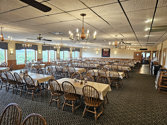 Chandeliers and Windsor chairs create a dining room where comfort food meets comfortable seating&mdash;the perfect combination.